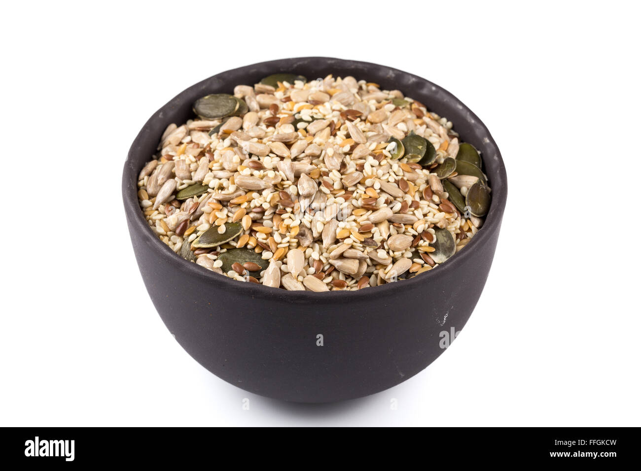 Healthy seeds mix in a stone bowl on white background Stock Photo - Alamy