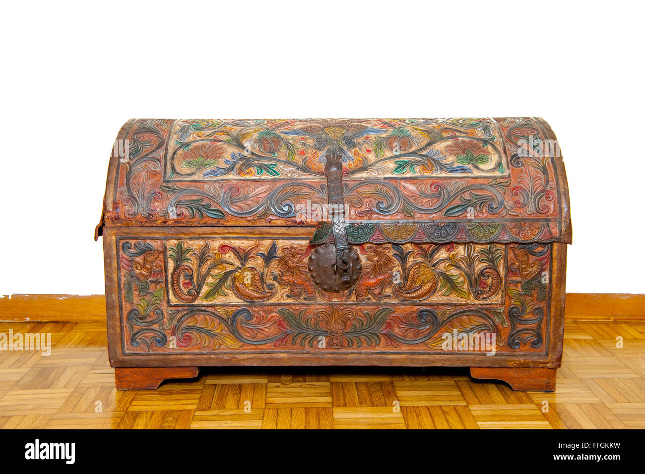Old close decorated chest on wooden floor and white background Stock ...