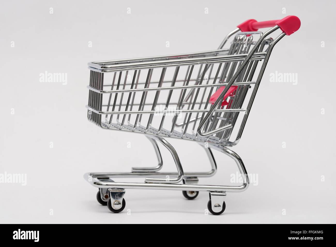 Small supermarket shopping trolley Stock Photo - Alamy