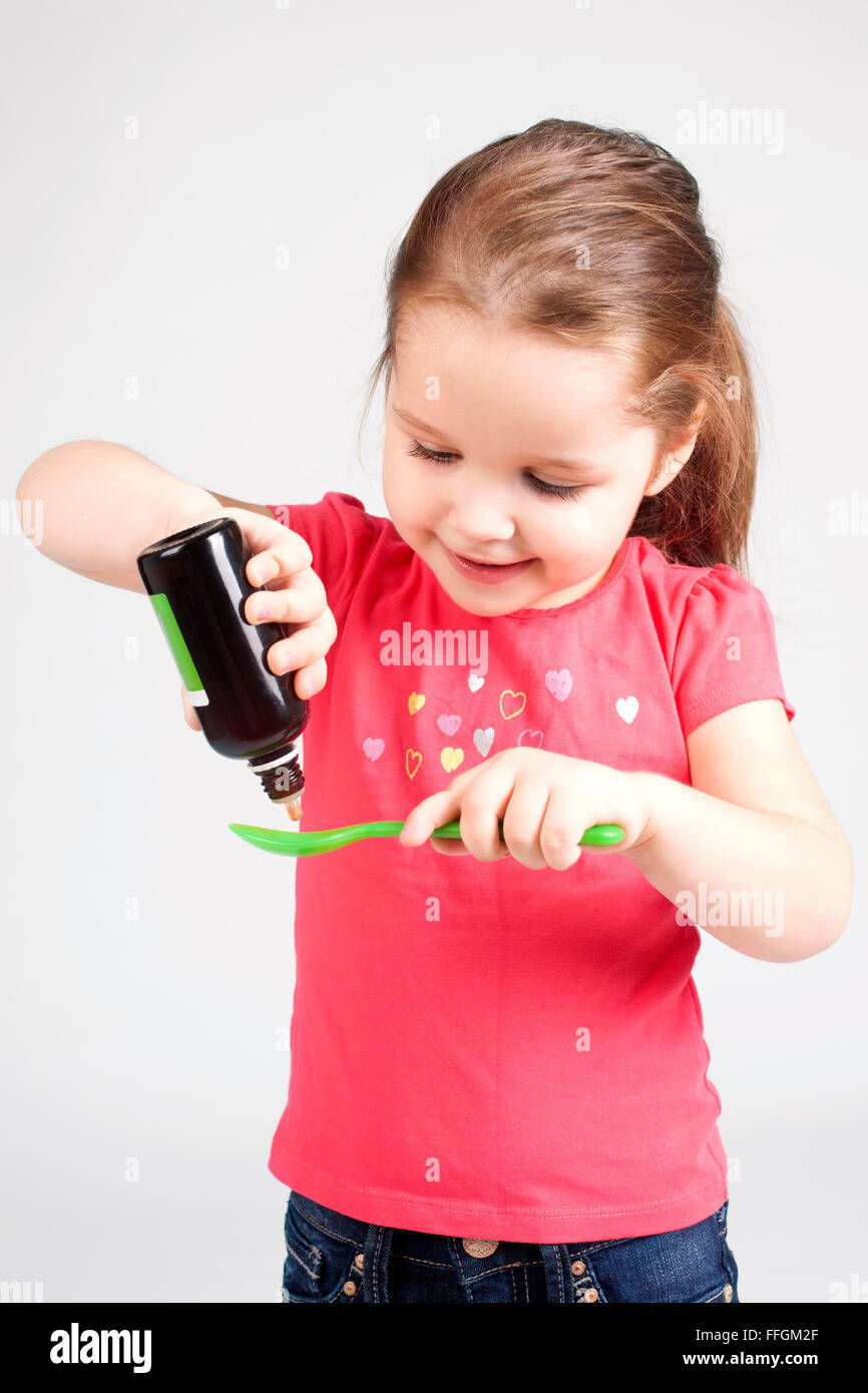 Medicine bottle and spoon hi-res stock photography and images - Alamy