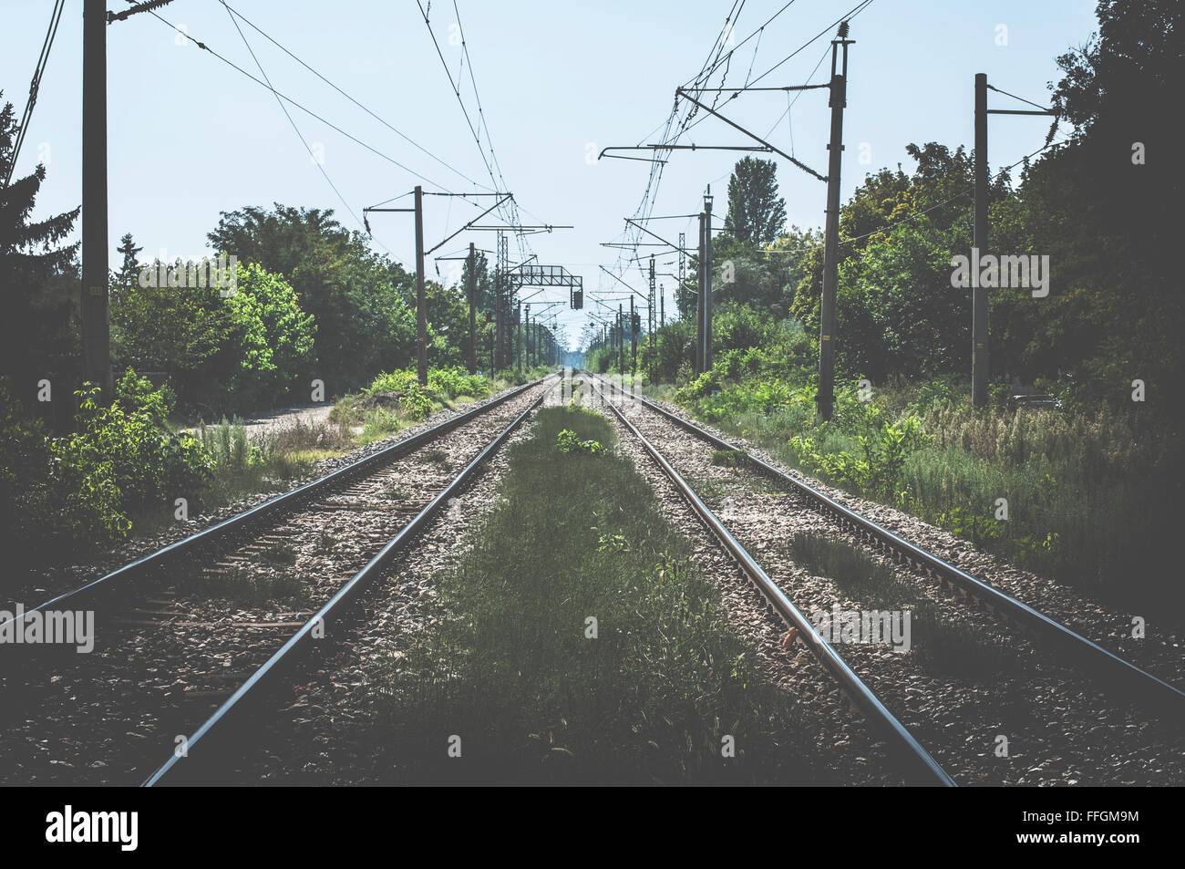 Two Railroads and power poles Stock Photo - Alamy
