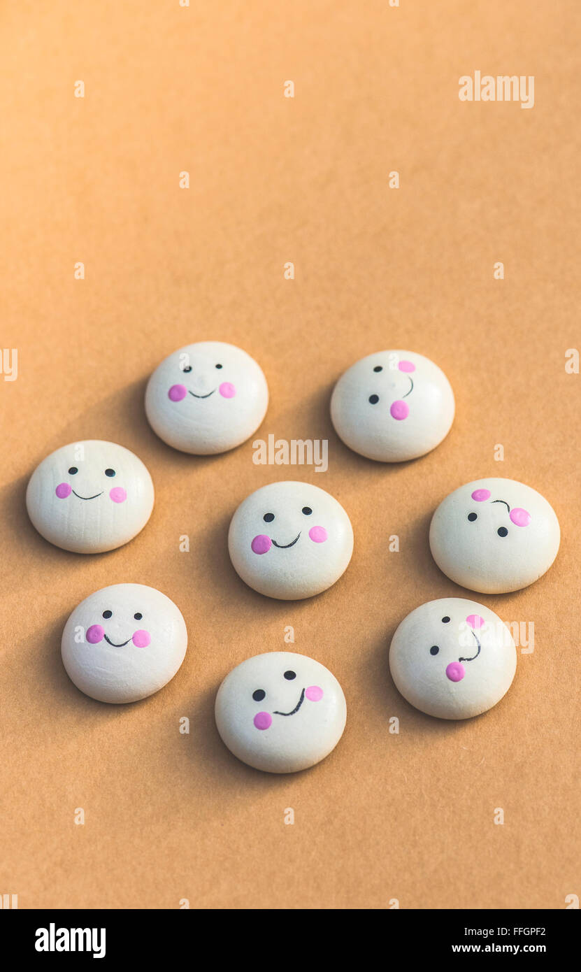 Smile icon on orange paper. Sun light Stock Photo - Alamy