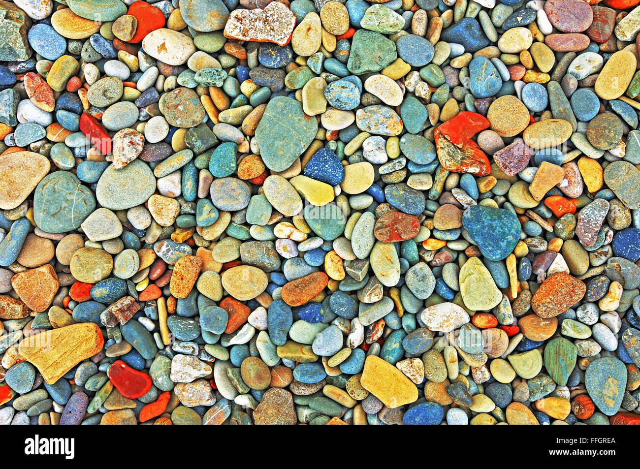 Multi-colored pebbles on the seashore Stock Photo - Alamy