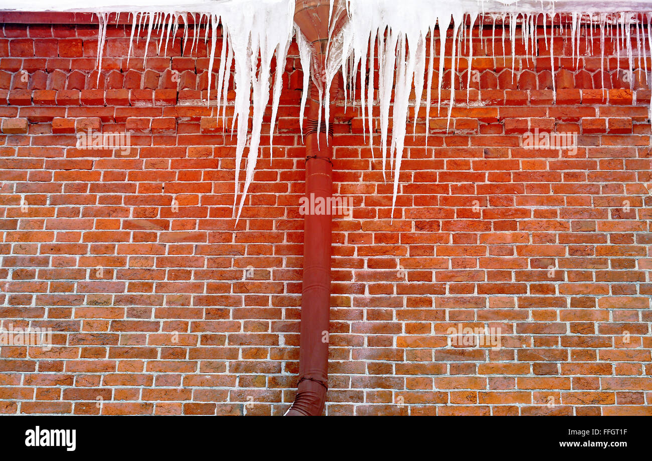 Beautiful ice icicles weigh on the building Stock Photo - Alamy