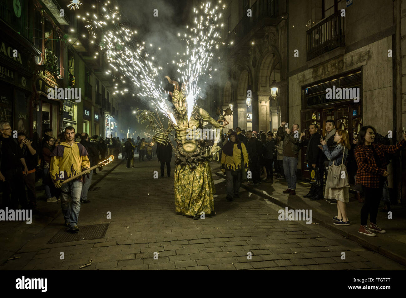 Barcelona, Catalonia, Spain. 13th Feb, 2016. A fire beast sets off his ...