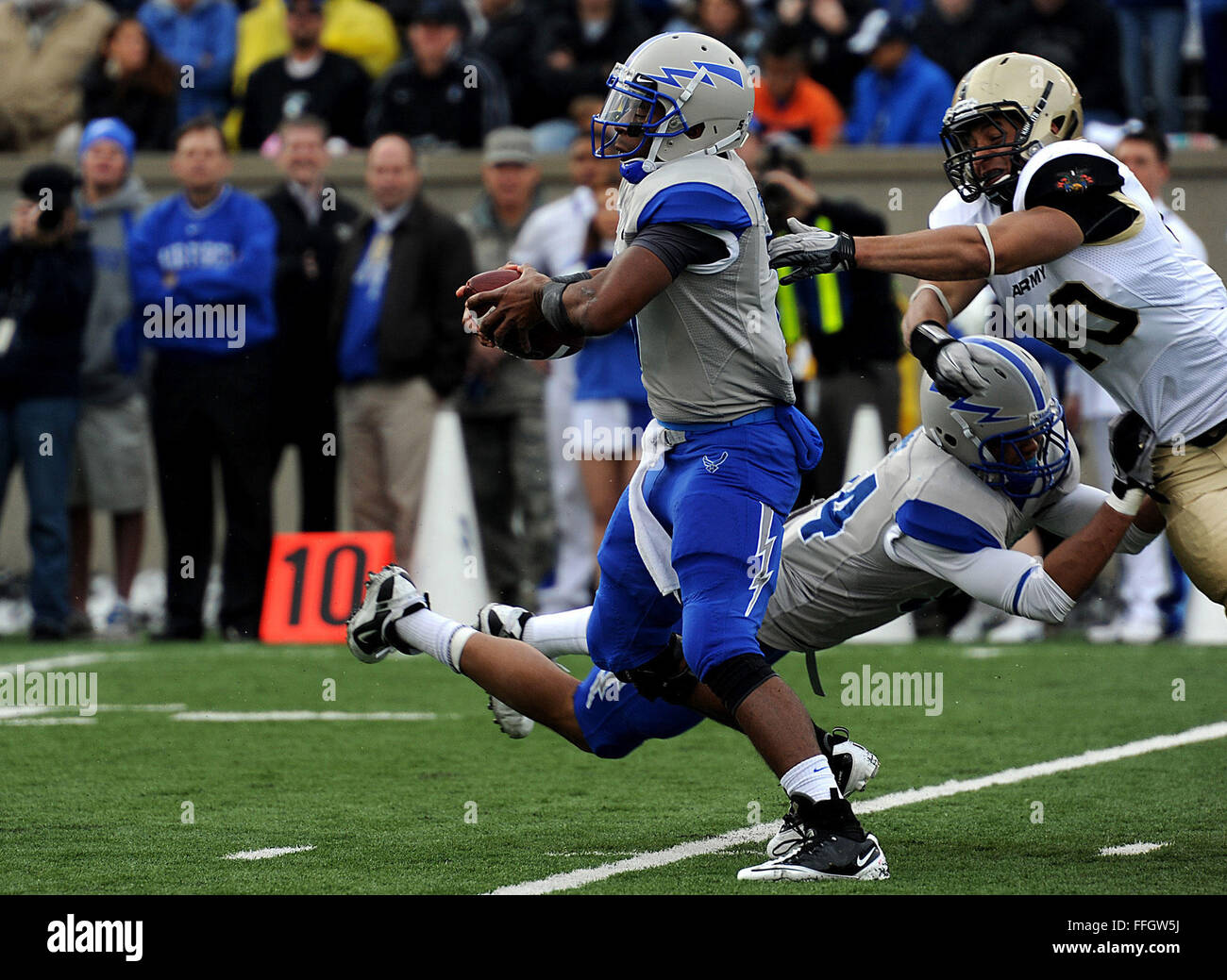 A U.S. Air Force Academy player delivers a key block on Army's Scott ...