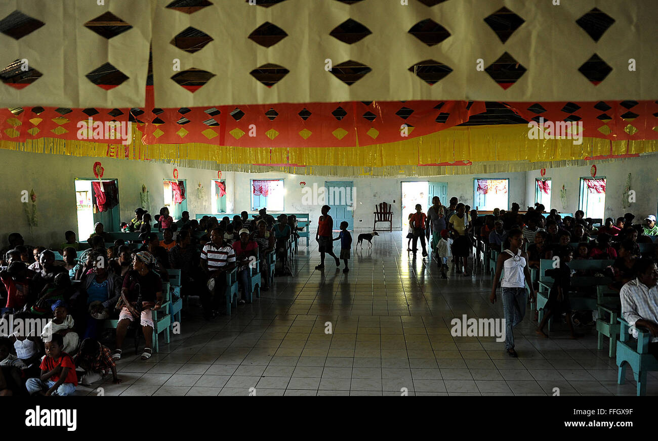 Honduran citizens wait inside the Wawina church for a preventive ...