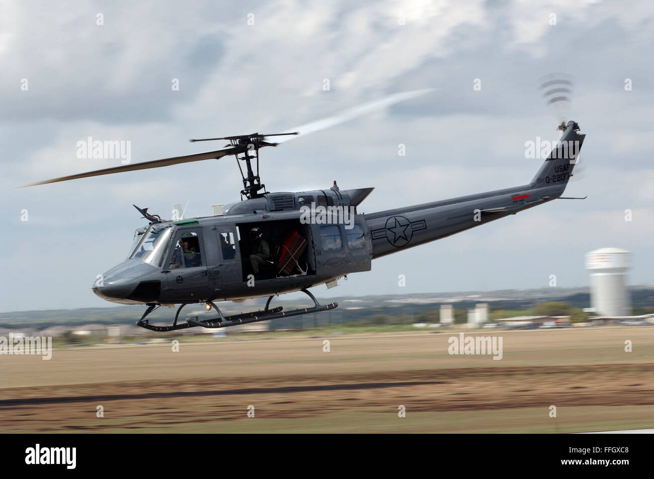 Capt. John Beurer (right seat) pilots the TH-1H trainer helicopter with ...