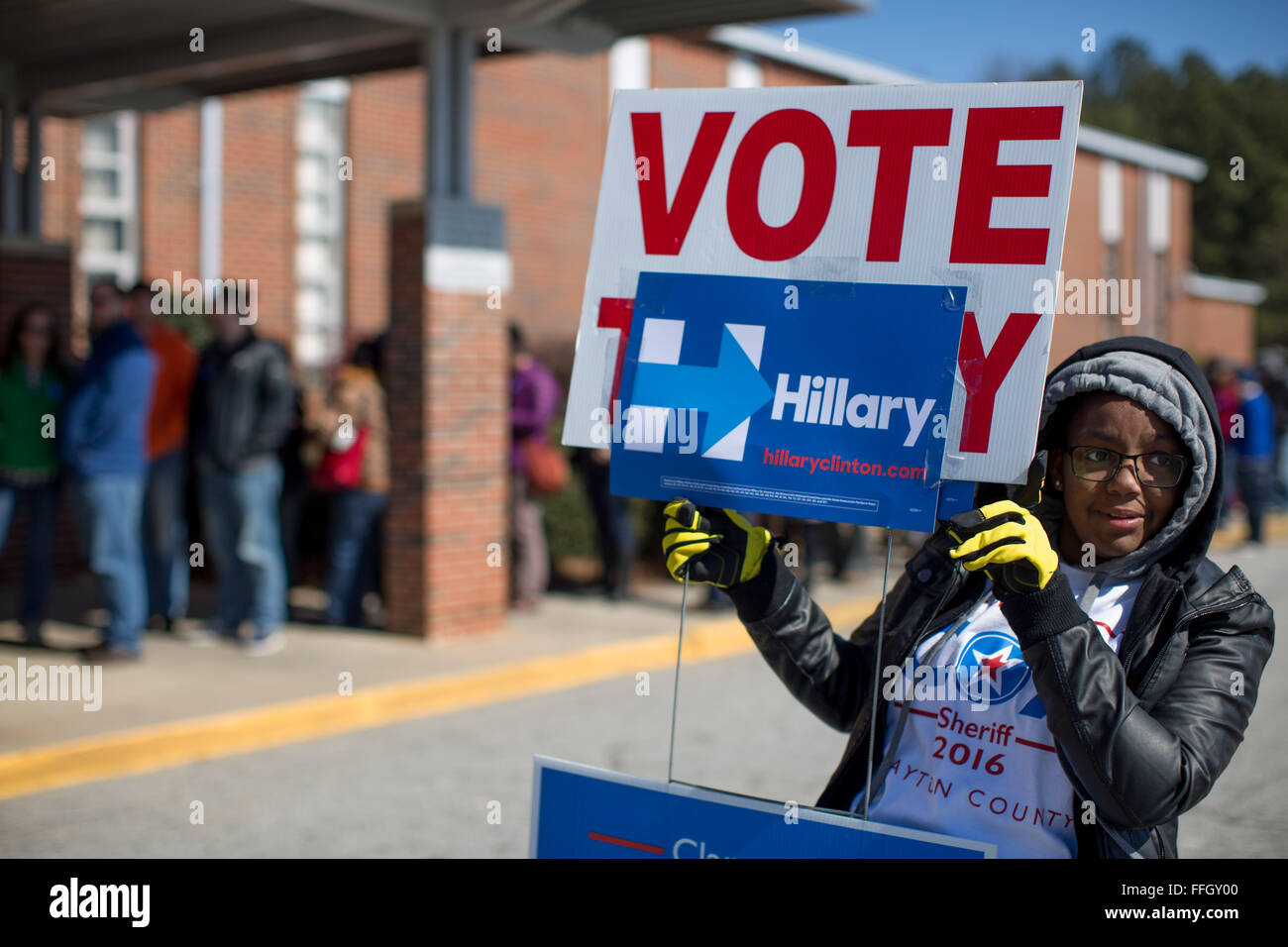 College Park, Ga, USA. 13th Feb, 2016. A woman carries a campaign sign ...