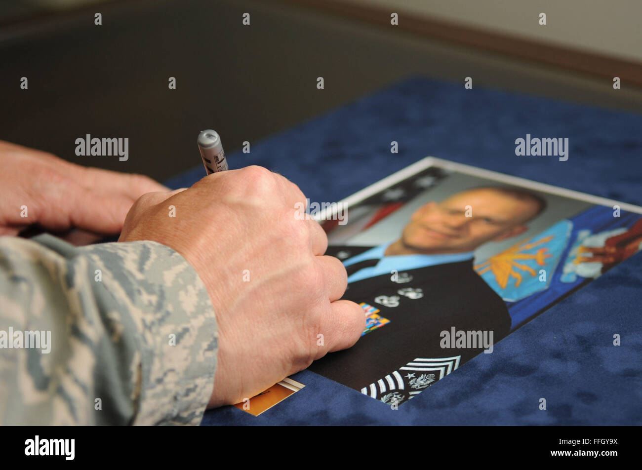 Chief Master Sgt. of the Air Force James A. Roy signs an official ...