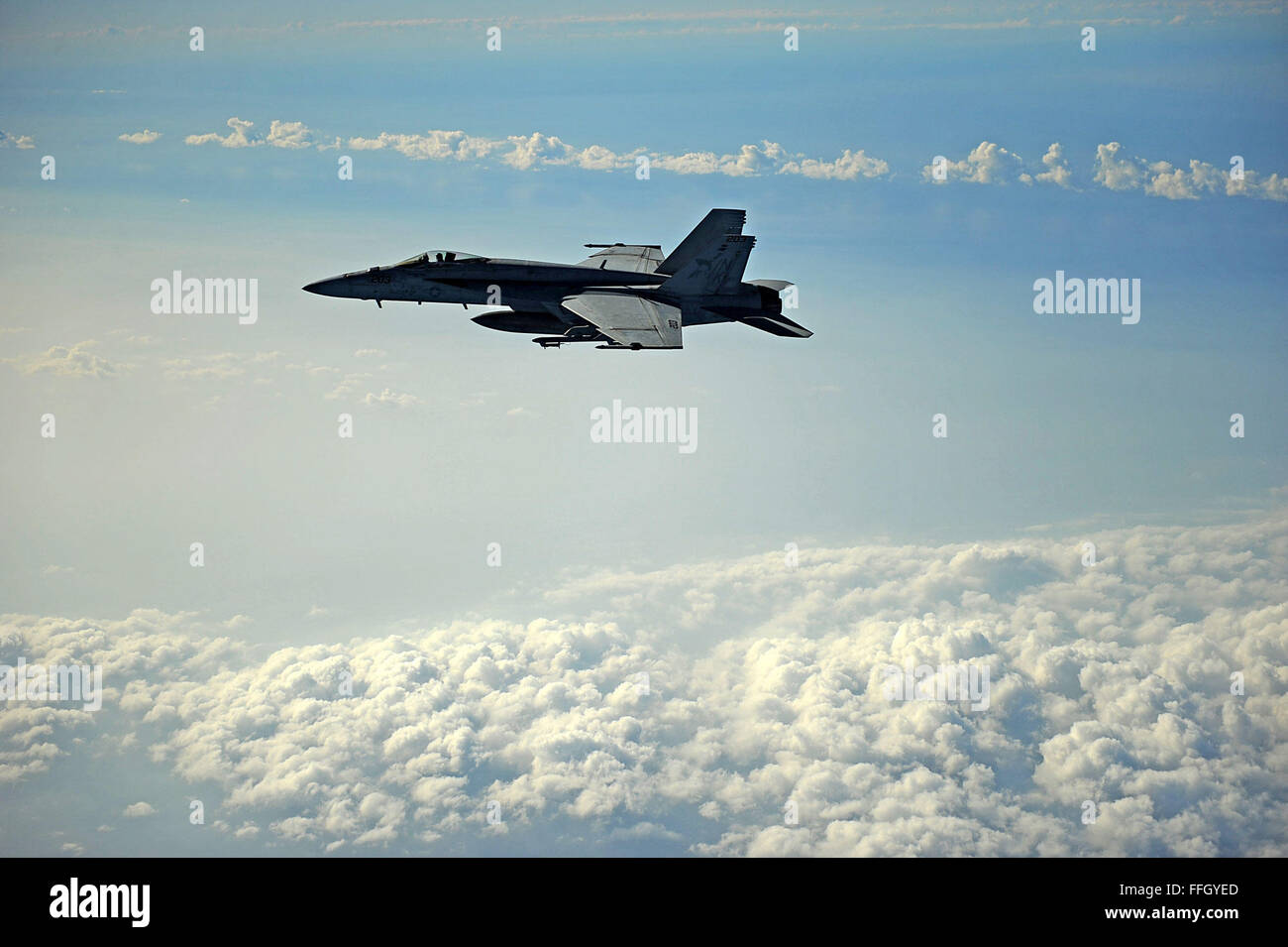 The 465th Air Refueling Squadron (ARS) performs aerial refueling with a ...