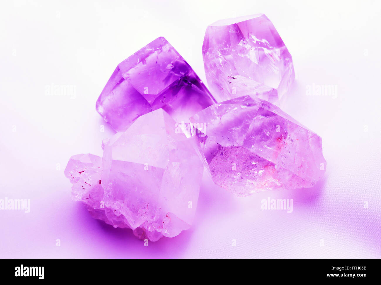 Amethyst colored quartz rock crystals Stock Photo - Alamy