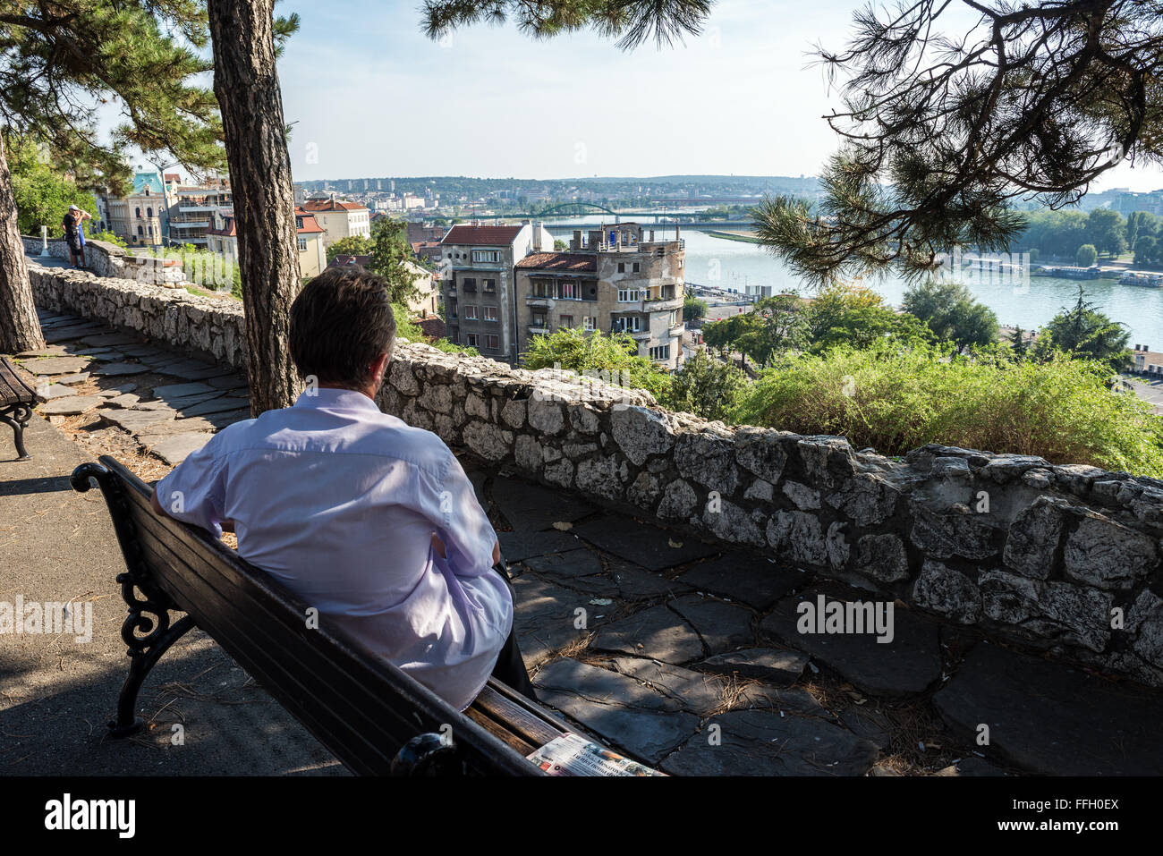 man sitting on a bench in promenade in Large Kalemegdan Park in ...