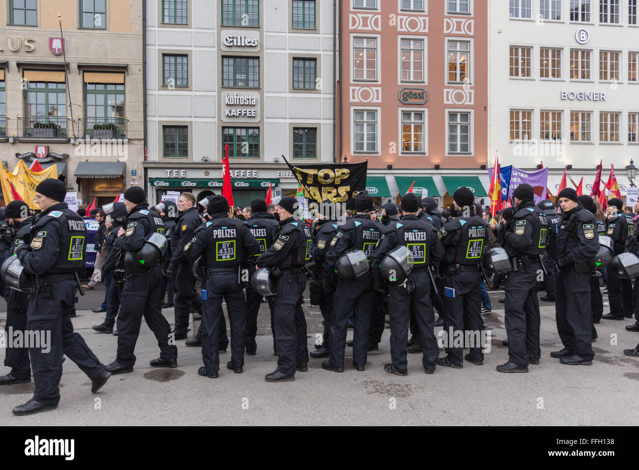 Munich, Germany. 13 Feb, 2016. Police chain along the demonstration ...