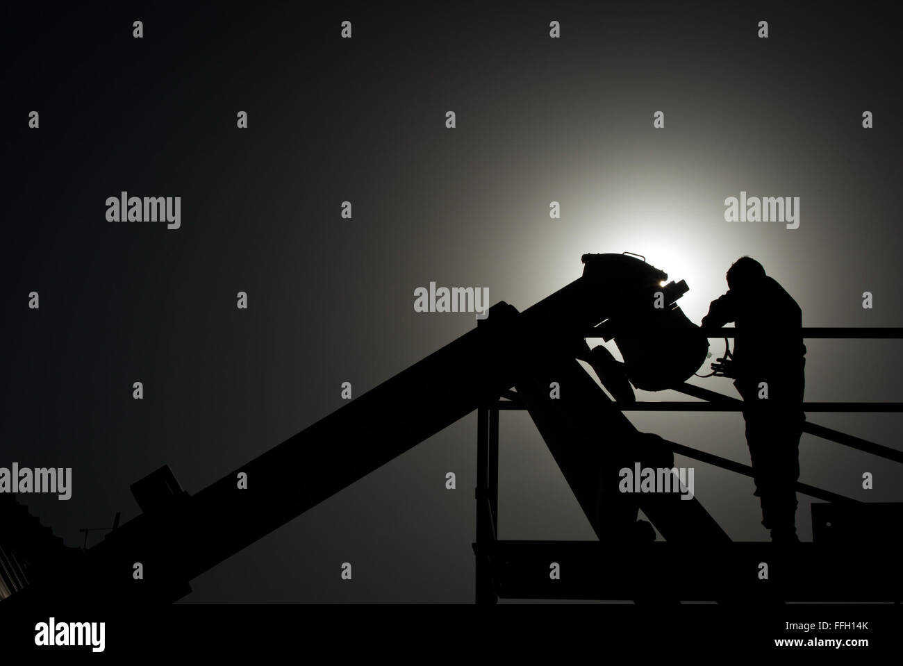 Senior Airman Erin O'Connell of Holloman Solar Observatory installs a ...