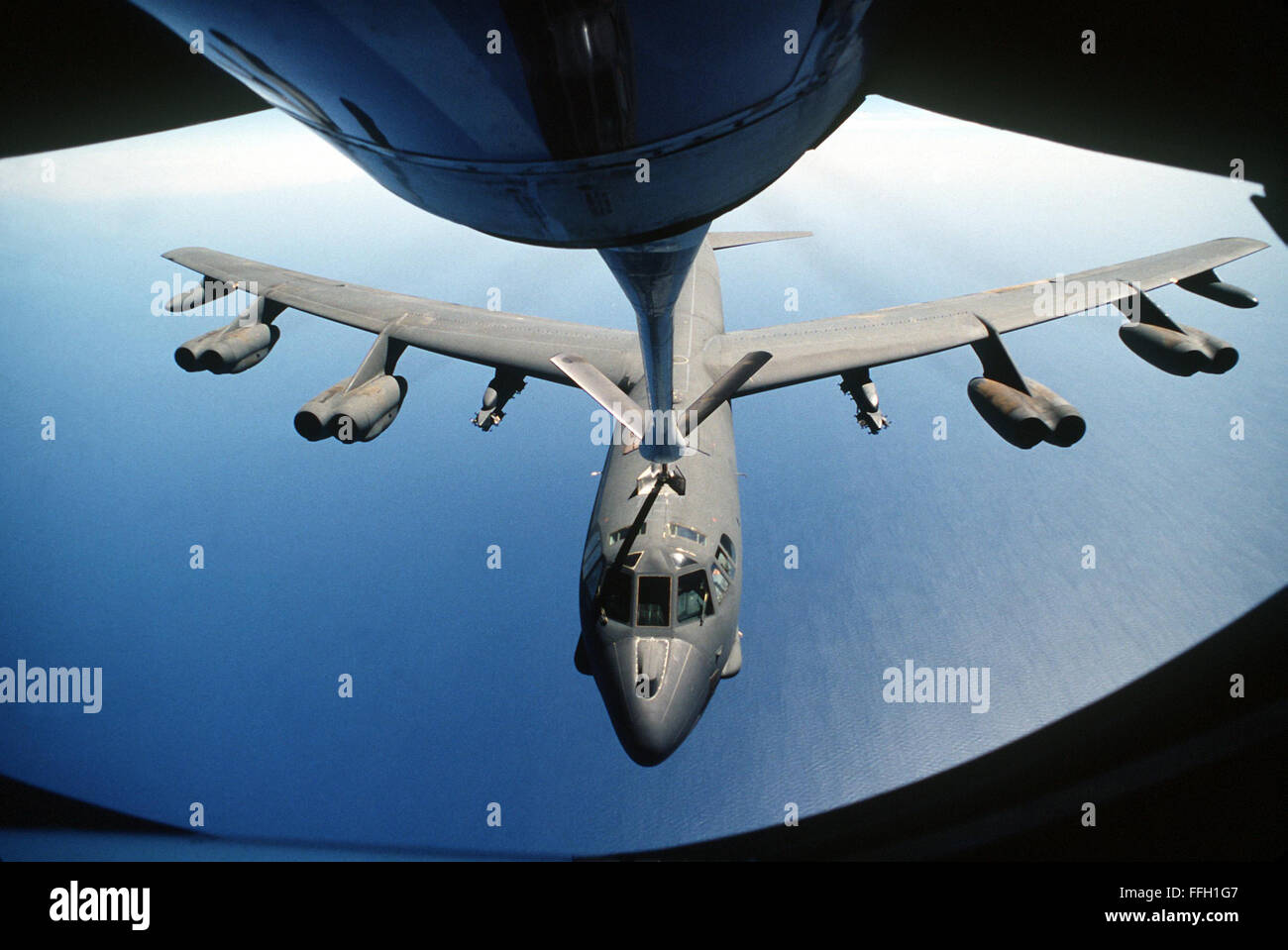 A KC-135 Stratotanker boom operator refuels a B-52 Stratofortress during air operations for ...
