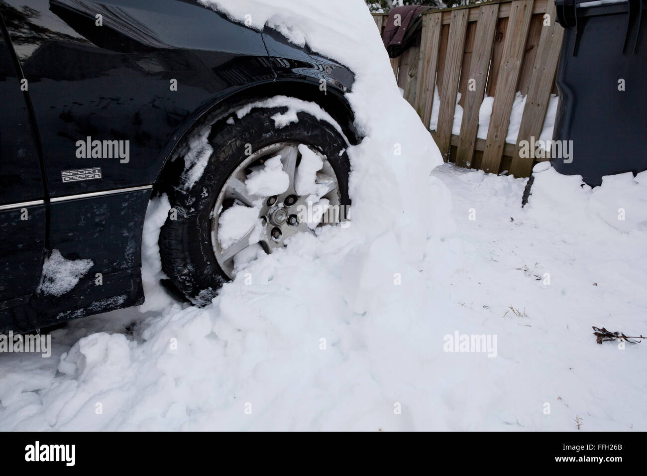 Car wheel covered in snow - Virginia USA Stock Photo - Alamy