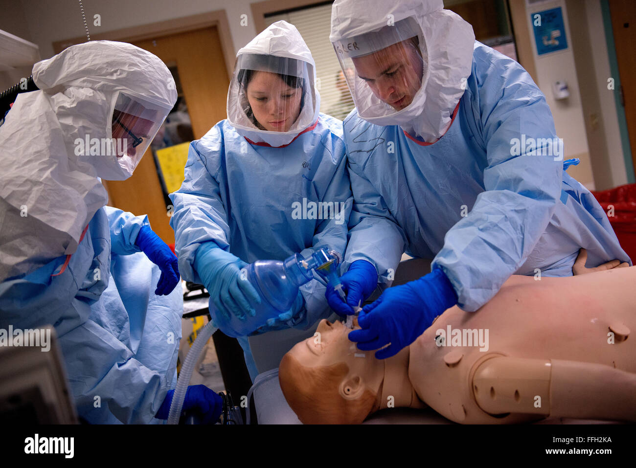 U.S. Navy Cmdr. (Dr.) Ryan Maves, Lt. Sarah Bush and Lt. j.g. Braden ...