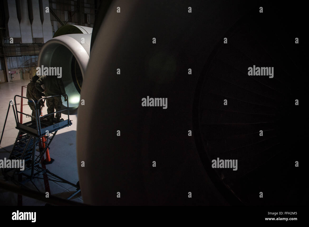 Master Sgt. Randy Rollins and Staff Sgt. Andrew Draime look for dents ...