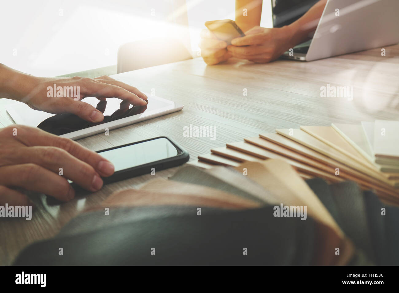 two colleagues interior designers discussing data with blank screen new ...