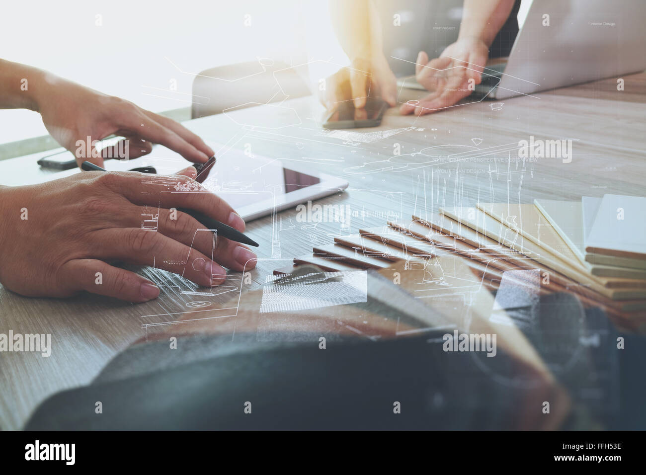 two colleagues interior designers discussing data with blank screen new ...