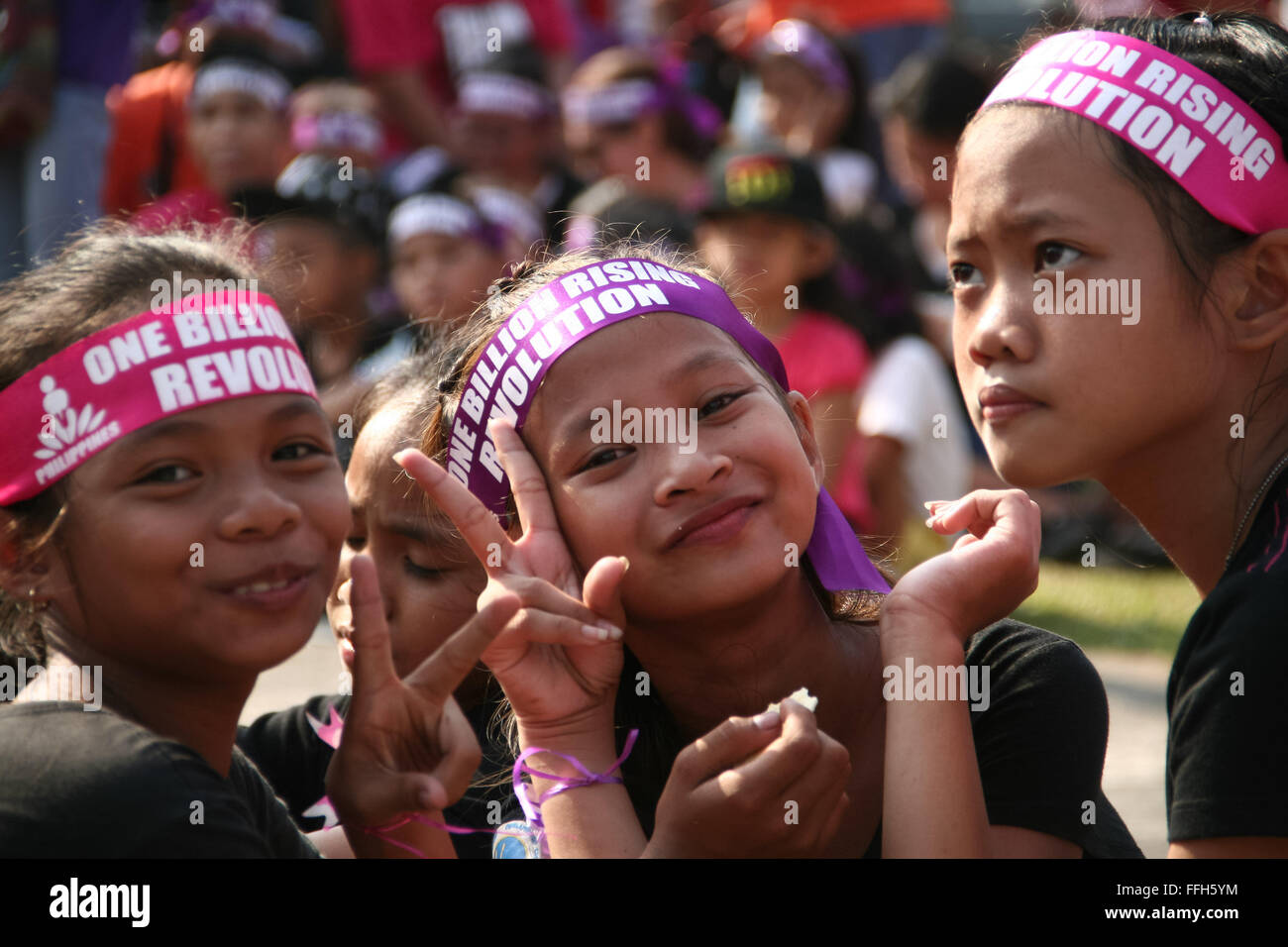 Manila, Philippines. 14th Feb, 2016. Young kids smiles with a peace ...