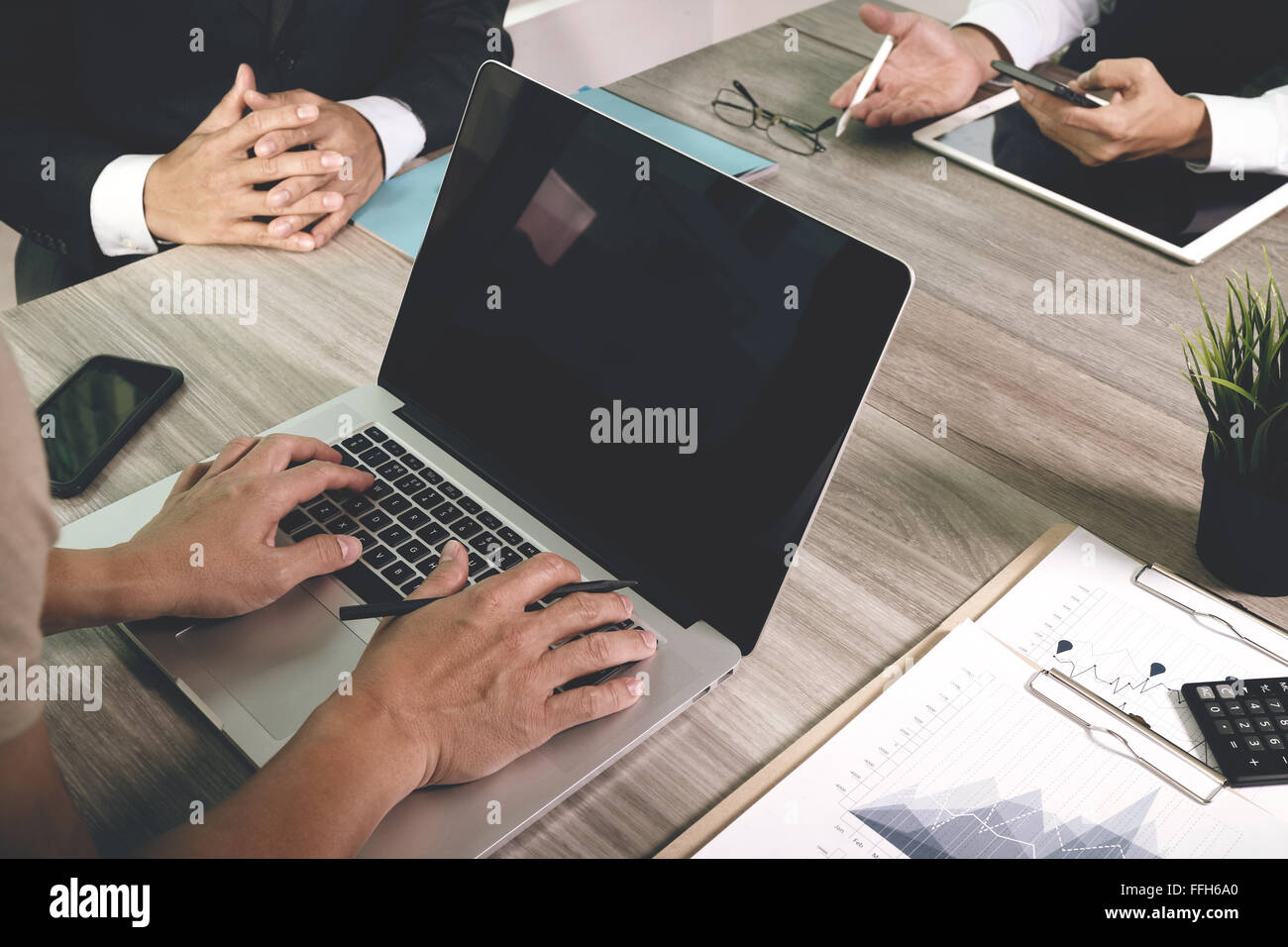 business documents on office table with smart phone and blank screen ...