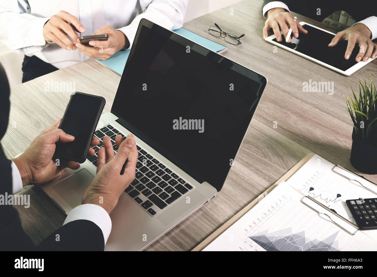 business documents on office table with smart phone and blank screen ...