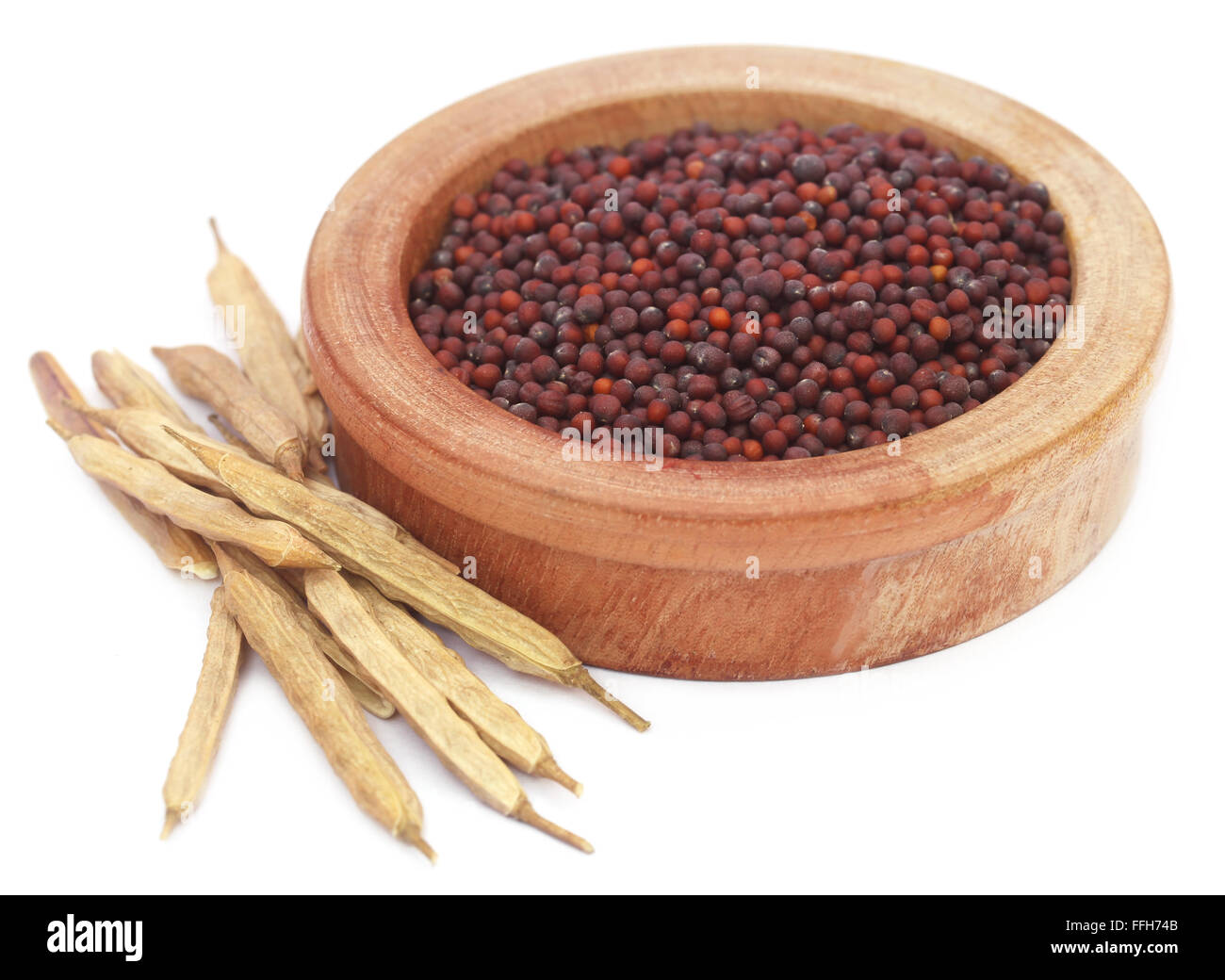 Fresh mustard with pods over white background Stock Photo - Alamy