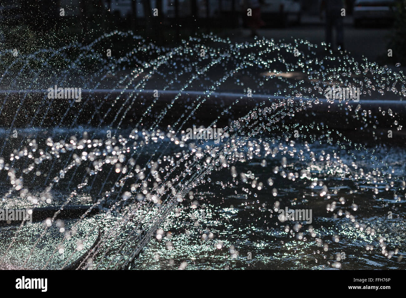 Water stream splashing on ground Stock Photo - Alamy