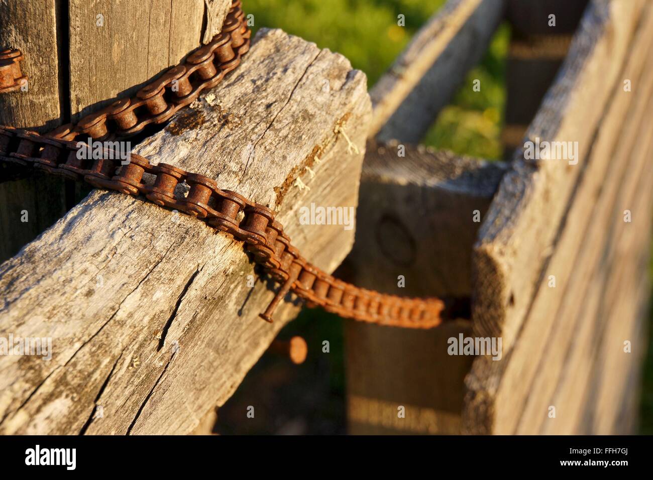 An old chain used to secure a gate Stock Photo - Alamy