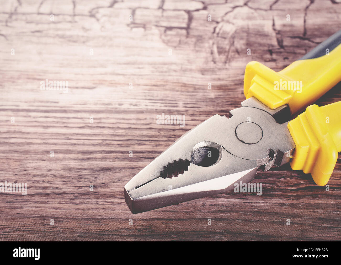 multitool pliers on wooden background Stock Photo - Alamy