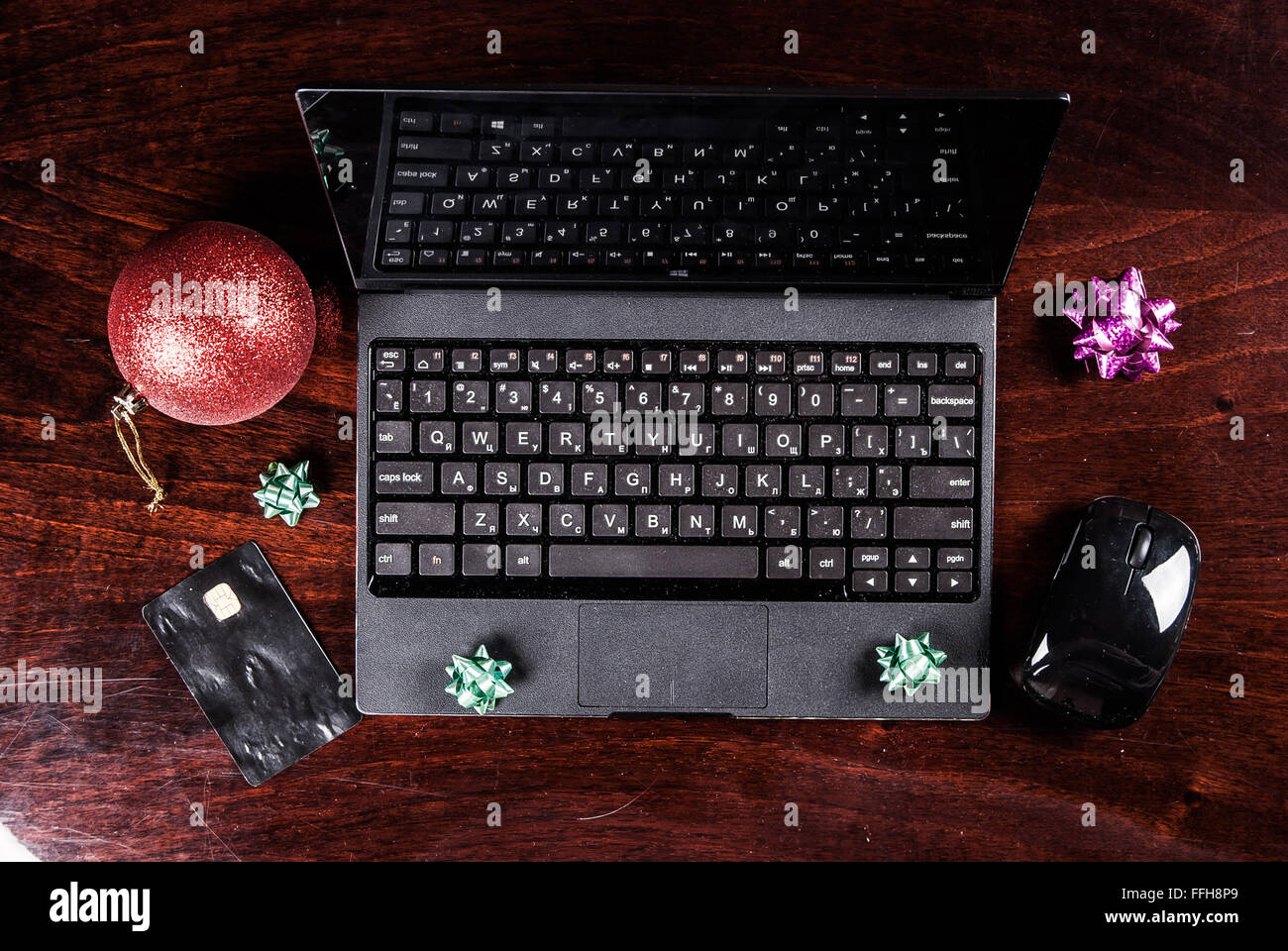 black laptop on wood Stock Photo - Alamy