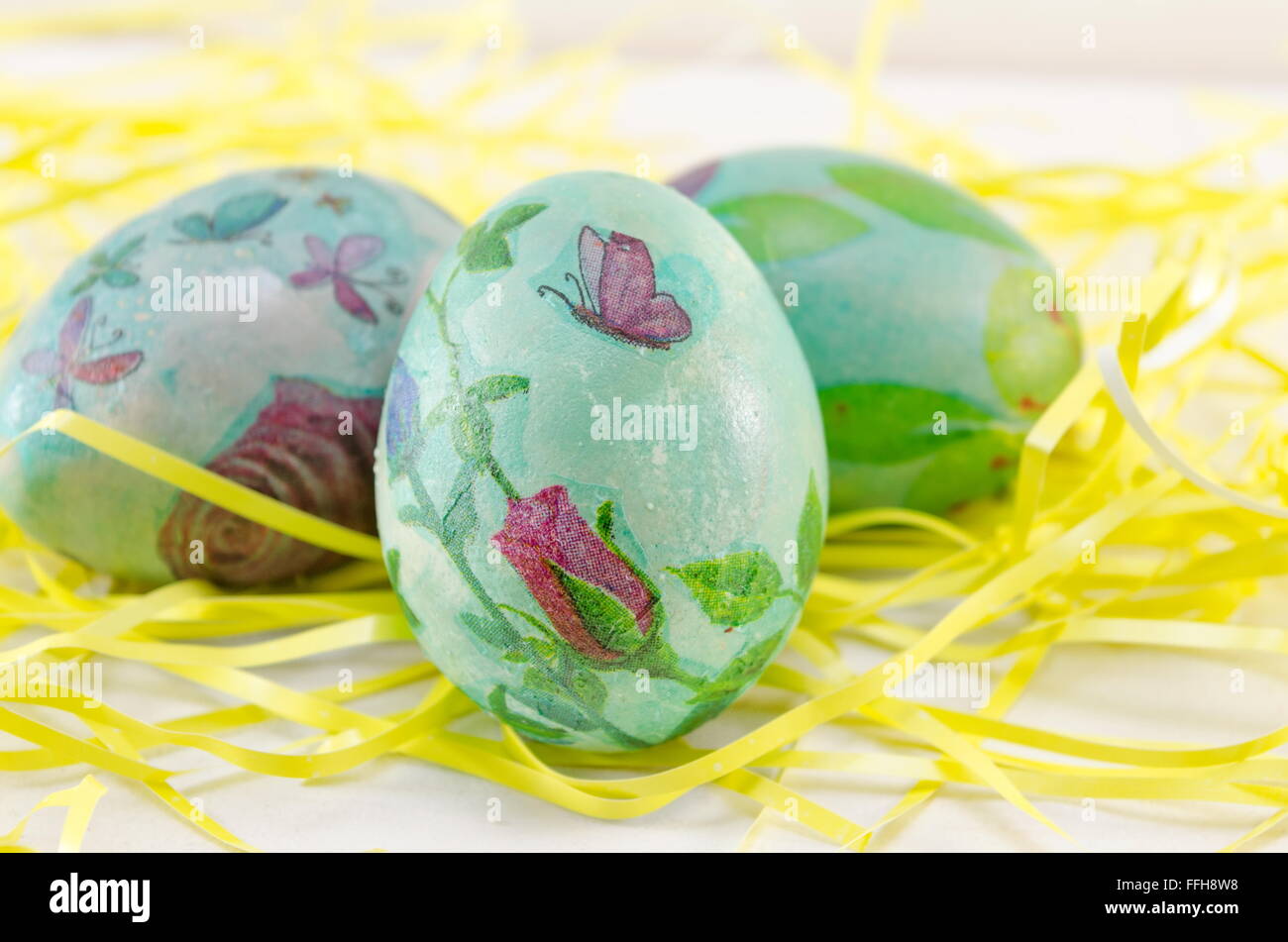 Hand painted decoupage Easter eggs in hay like straws Stock Photo - Alamy