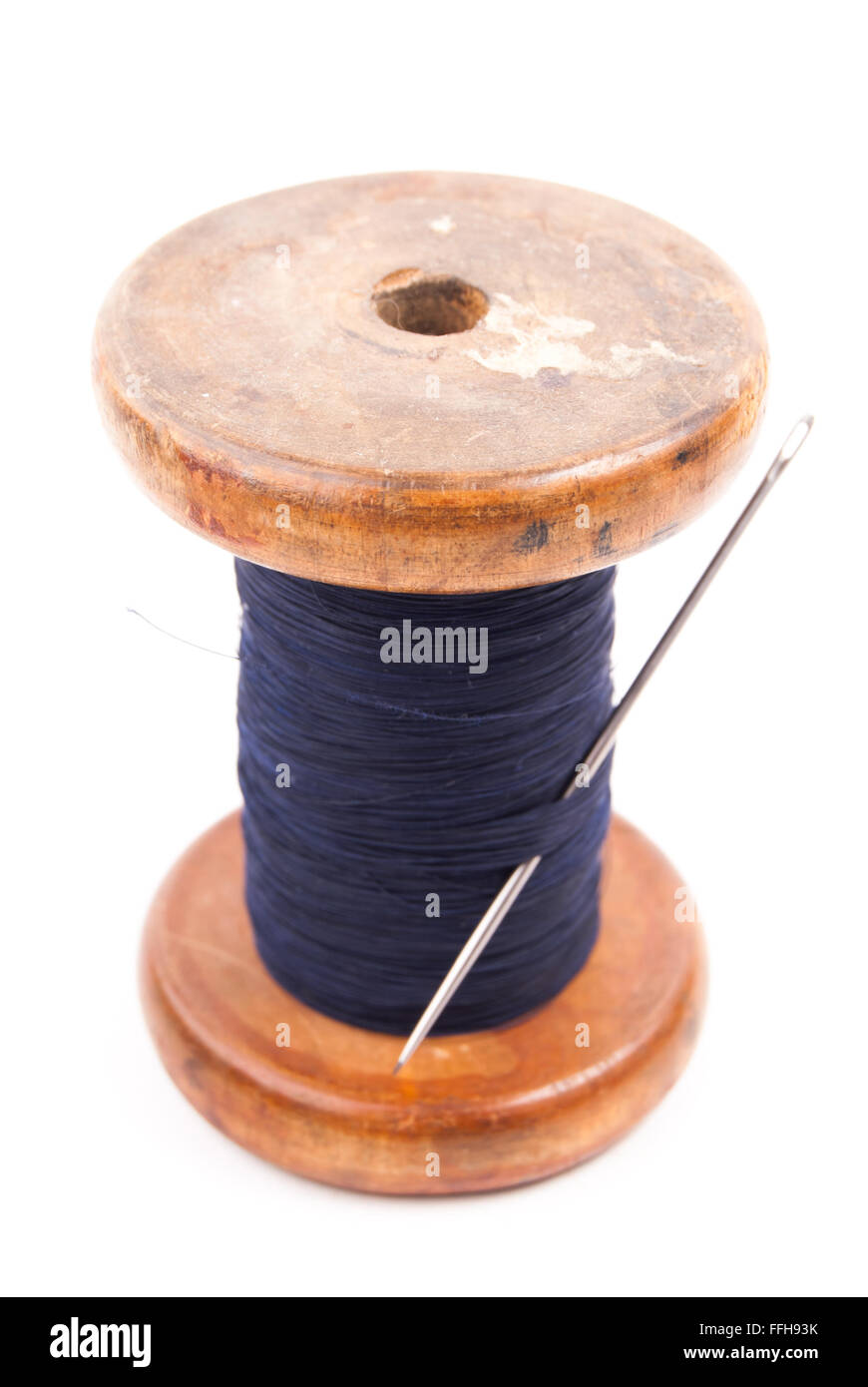 spool of thread with needle Stock Photo - Alamy