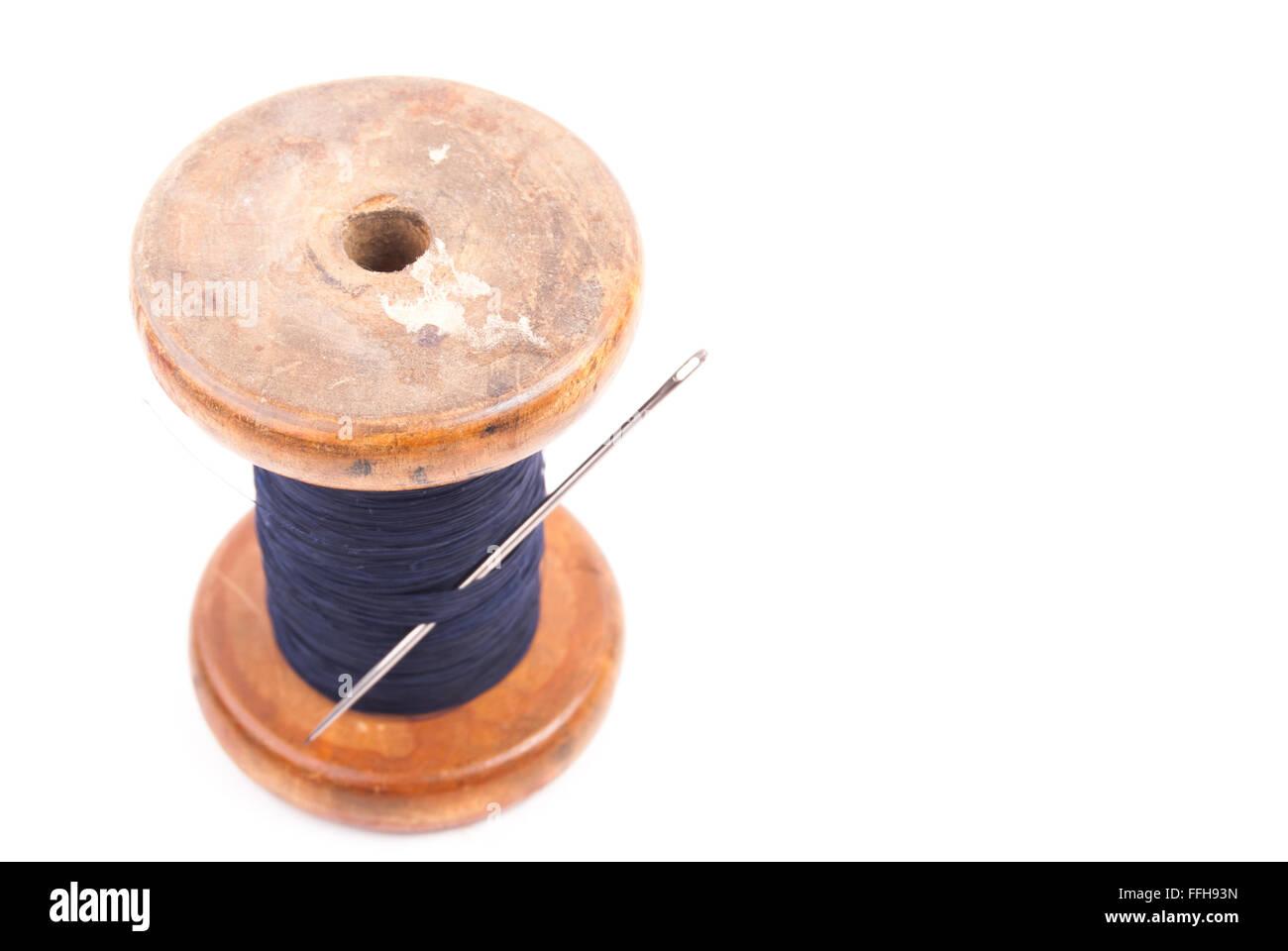 spool of thread with needle Stock Photo - Alamy