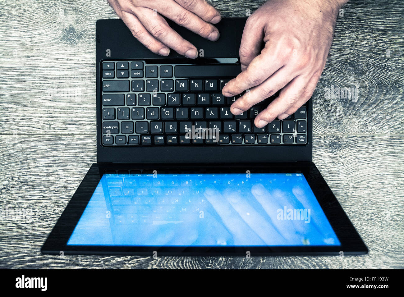 laptop with hands on wood Stock Photo - Alamy