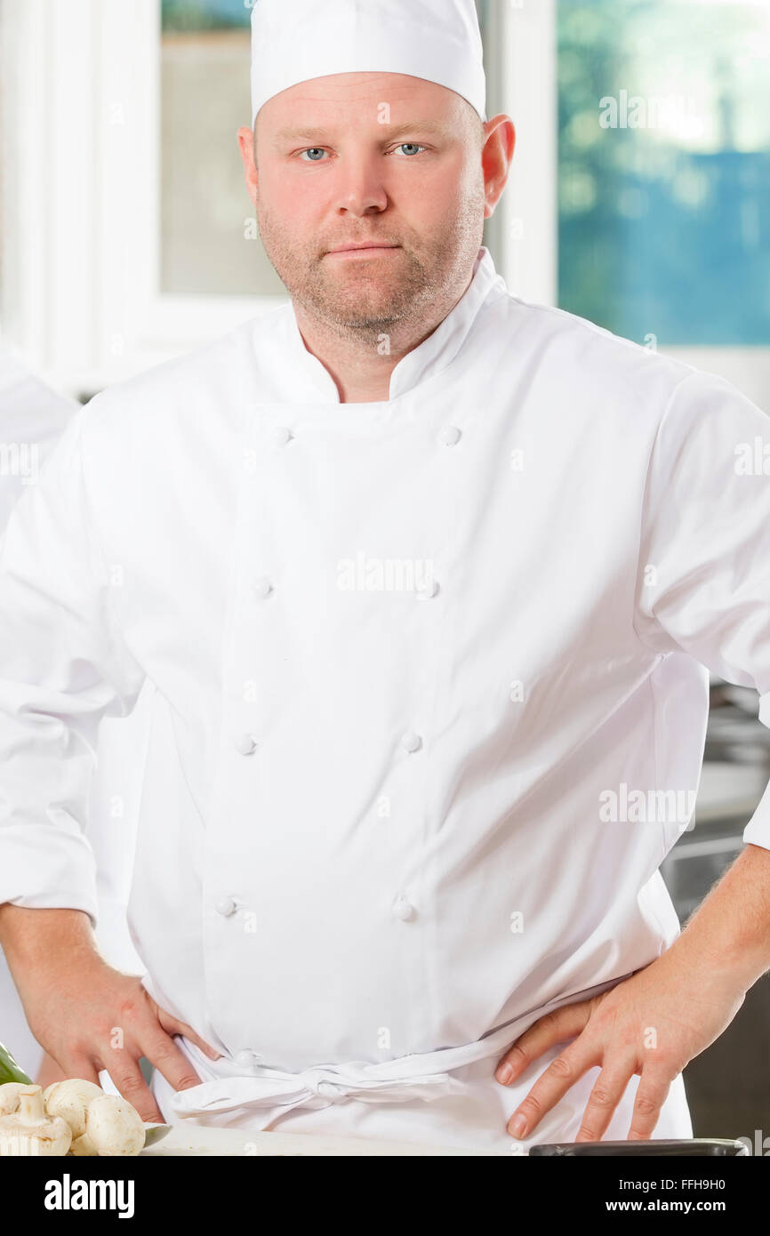Portrait of confident chef in large kitchen Stock Photo - Alamy