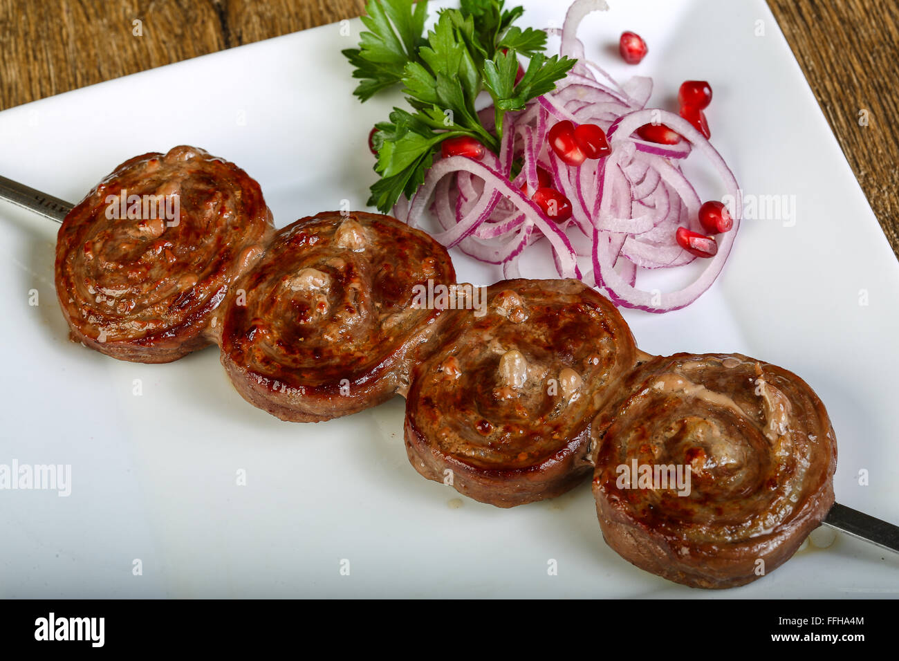 Grilled lamb bbq with herbs, onion and spices Stock Photo - Alamy