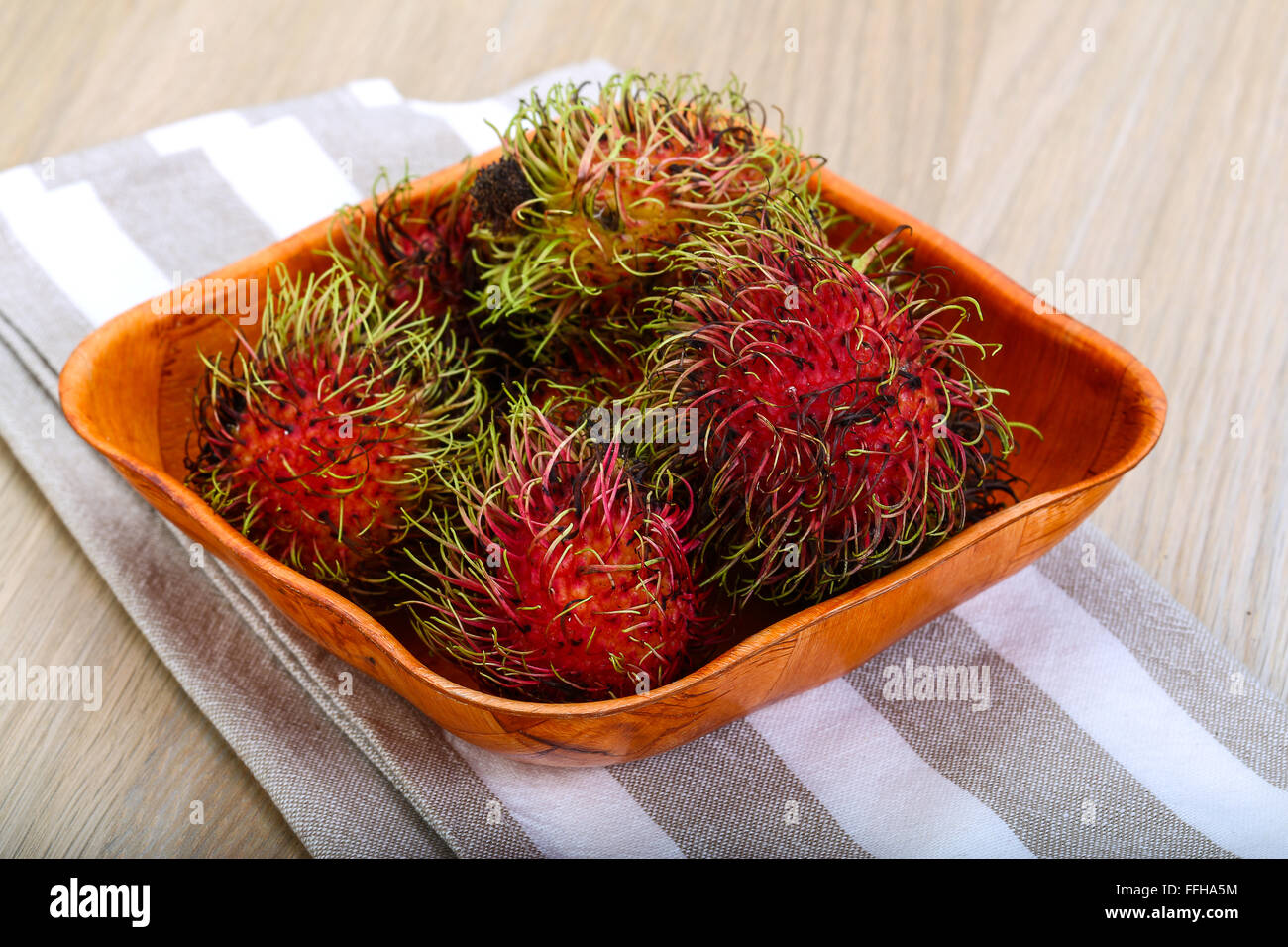 Fresh ripe sweet rambutan in the basket Stock Photo - Alamy
