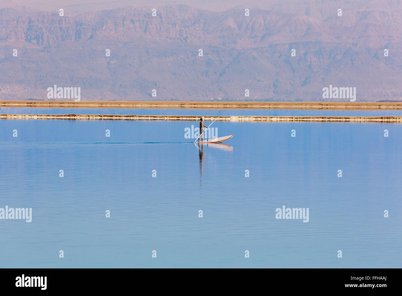 man floats on a boat in the dead sea Stock Photo - Alamy