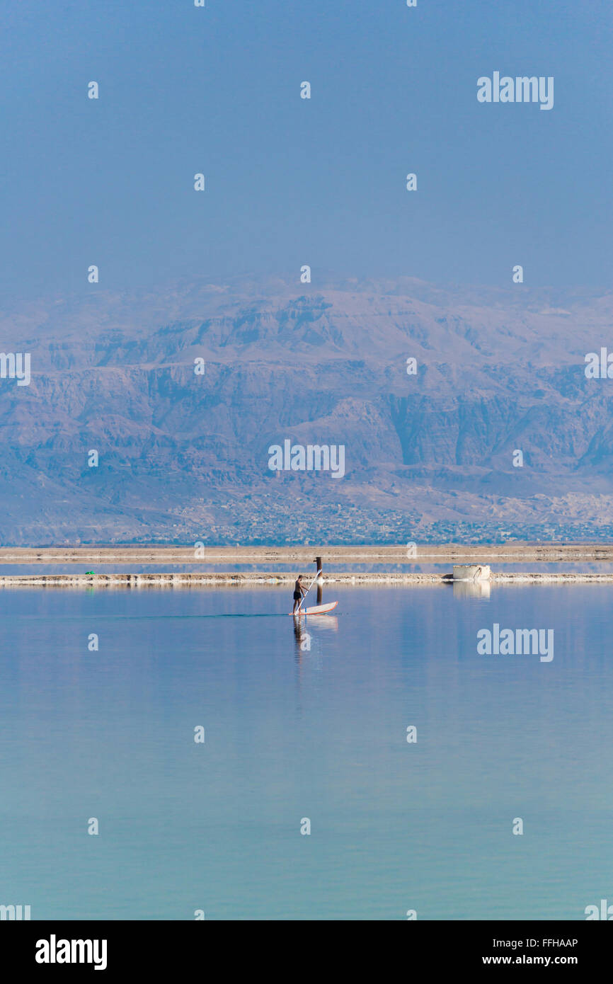 man floats on a boat in the dead sea Stock Photo - Alamy
