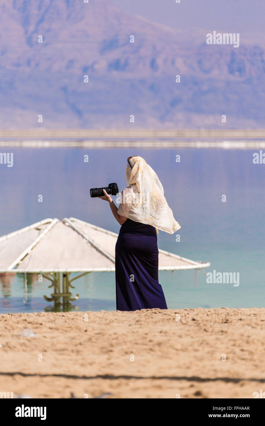 Woman resting on the beach Dead Sea Stock Photo - Alamy