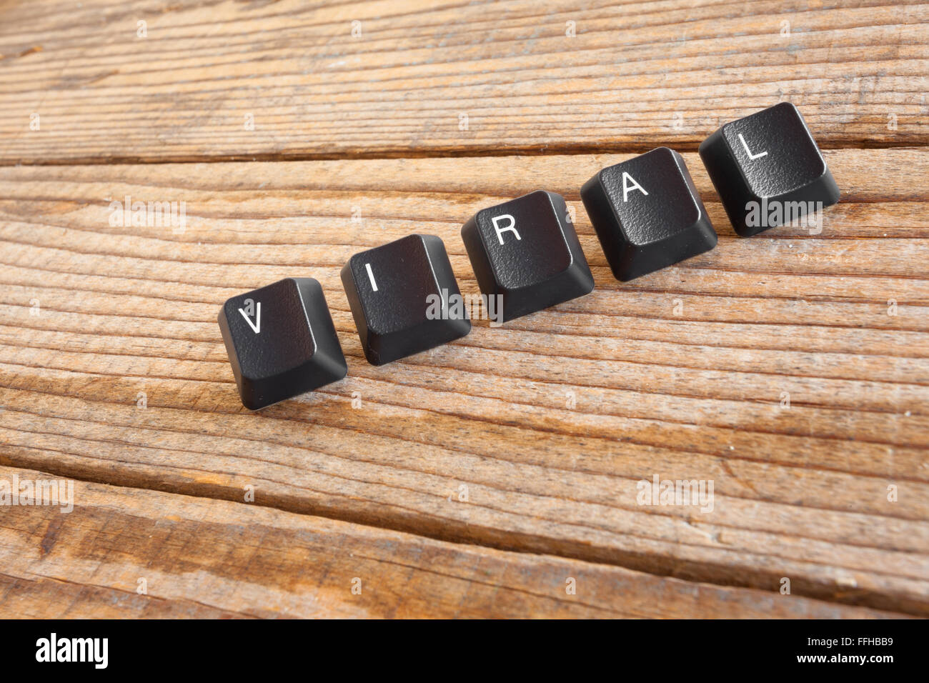 "VIRAL" wrote with keyboard keys on wooden background Stock Photo - Alamy