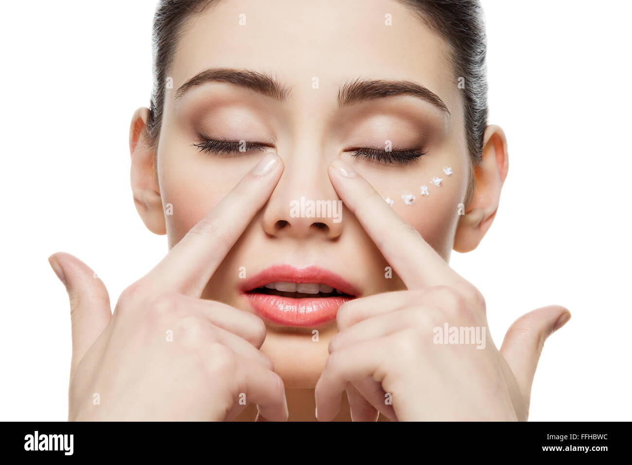 Girl with cream dots on face Stock Photo - Alamy