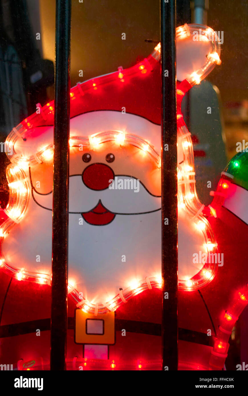 Santa behind bars / shop decoration, Thirsk Stock Photo - Alamy