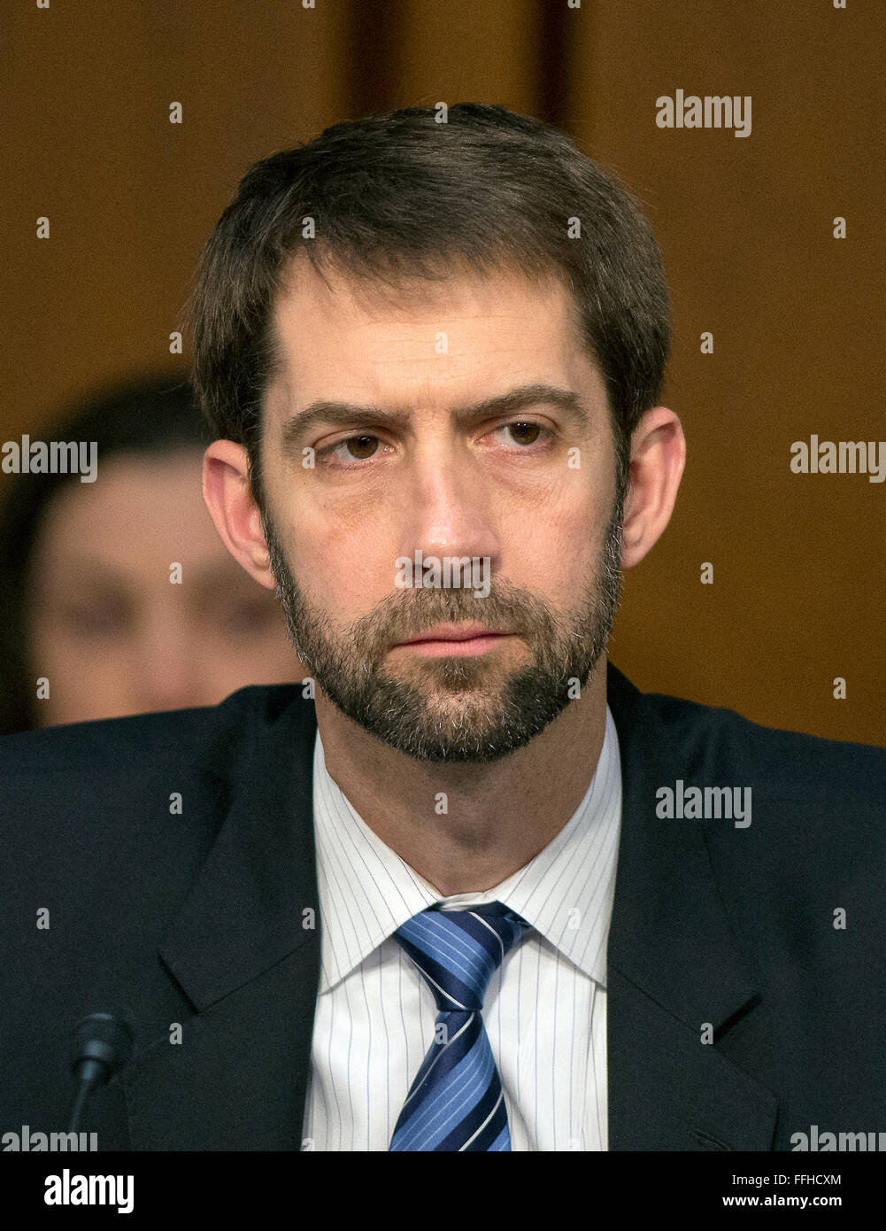 United States Senator Tom Cotton (Republican of Arkansas) listens as ...