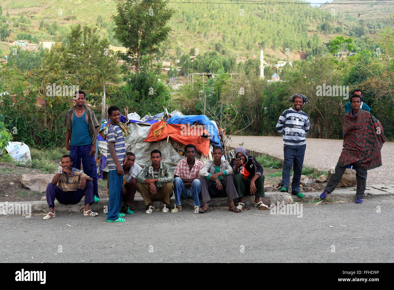 KOMBOLCHA, ETHIOPIA-MARCH 24: Friendly bunch of men wait for the ...