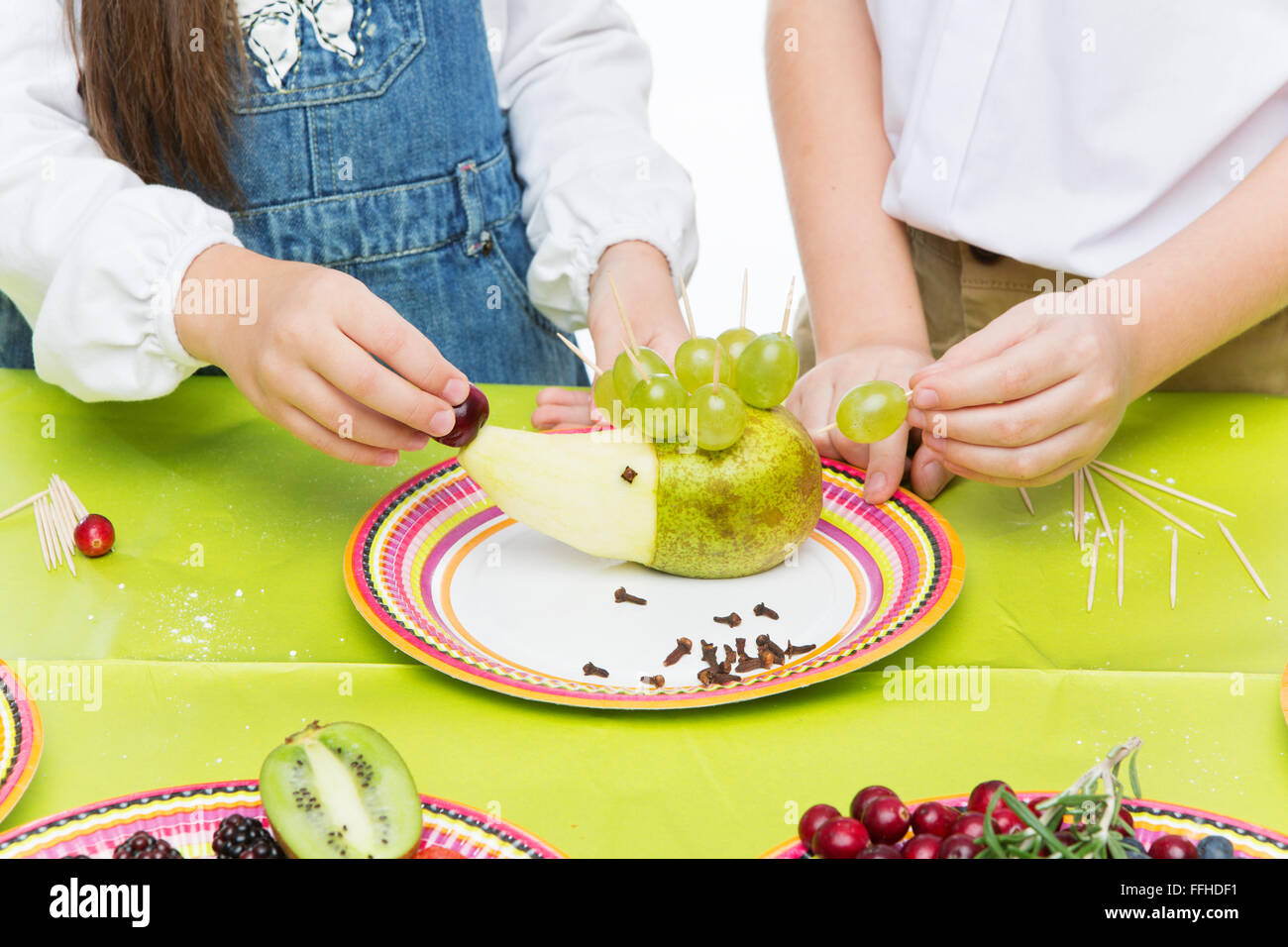 Children making fruit hedgehog Stock Photo - Alamy