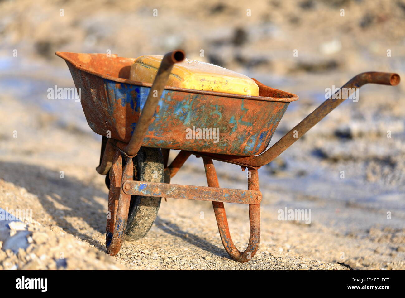 Rusty old wheelbarrow-artificial pond for water evaporation-salt mound ...
